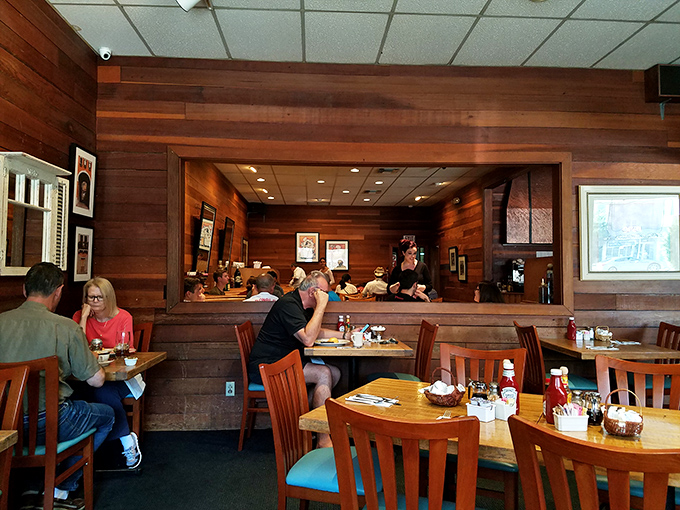 A dining room where conversations happen without shouting and the wood paneling somehow makes your pancakes taste better.