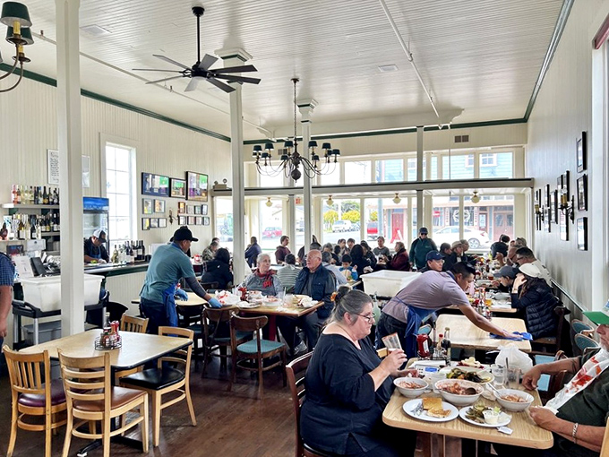 A bustling dining room where strangers become friends, united by the universal language of "Oh my God, you have to try this!"