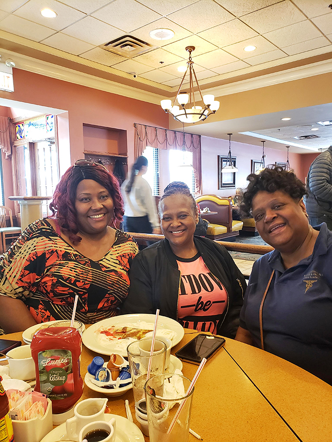 Happy diners sharing a moment of breakfast bliss&mdash;the universal language of "this was worth getting out of bed for."