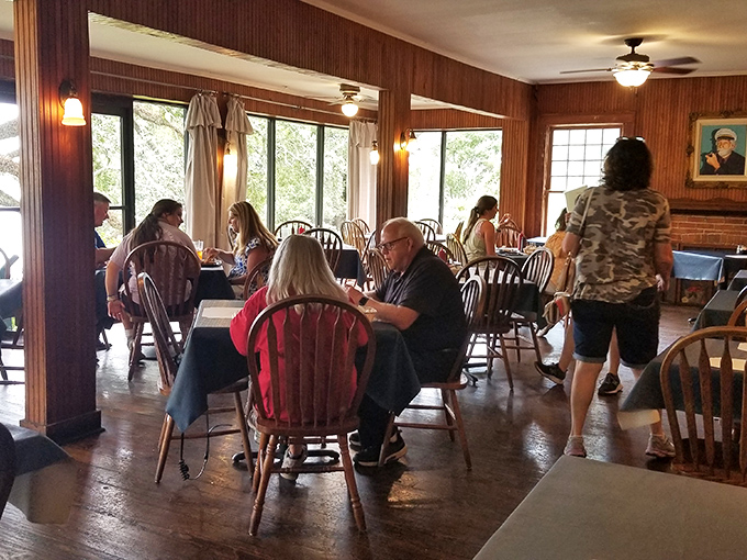 Diners lost in conversation and catfish&mdash;the universal language of a shared meal bringing people together.