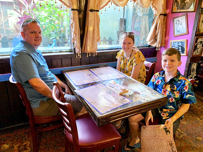 Happy diners experiencing the joy of excessive portion sizes and surroundings that make adult worries dissolve faster than sugar in hot coffee.