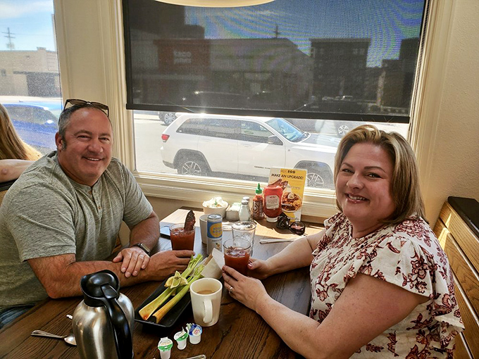 Happy diners enjoying that magical moment when coffee arrives and breakfast is imminent. Their smiles say it all.