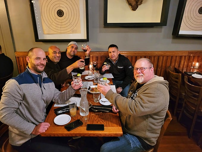The universal language of "cheers" being spoken fluently. These gentlemen understand that great steak is best enjoyed with great company.