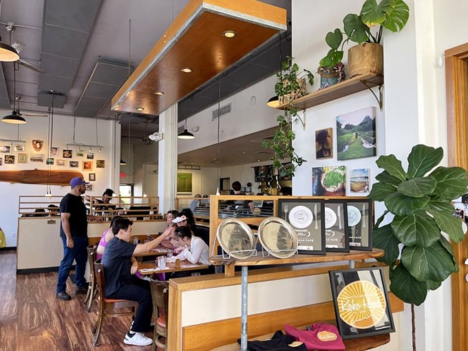 A glimpse of paradise in progress &ndash; diners enjoying their morning feast surrounded by greenery and natural light. This is how brunch should feel.