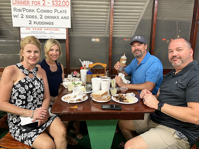 Happy faces around a table of barbecue&mdash;the universal language of food bringing people together for a feast worth remembering.