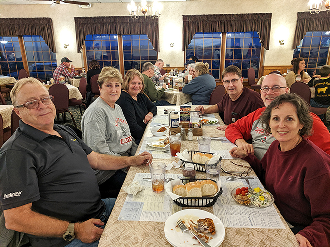 Happy diners mid-feast demonstrate the universal language of satisfaction that transcends words and dietary restrictions completely.