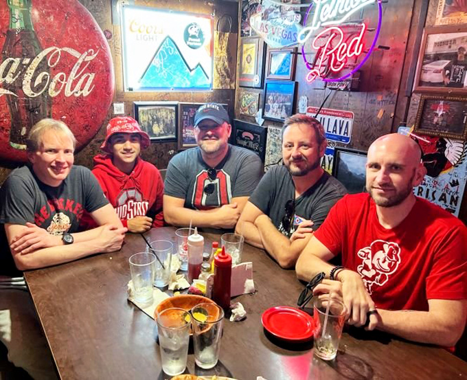 A group of friends who came for burgers but stayed for the camaraderie. That table has heard more laughter than most comedy clubs.