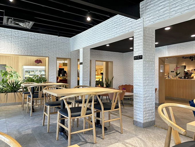 Clean lines, natural light, and wooden accents create a dining space where you'll want to linger long after your plate is empty.