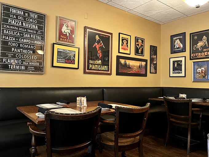 Italian street signs and vintage posters create an atmosphere that whispers "authenticity" without shouting "theme restaurant."