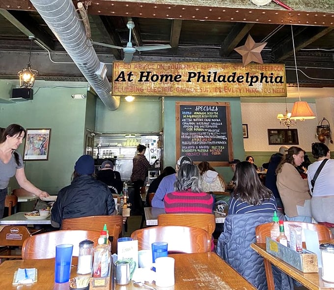 Vintage signs and exposed ductwork create an industrial-cozy vibe where even first-time visitors feel like they've discovered their new favorite spot.