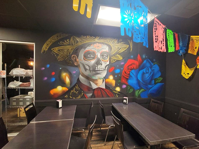 The striking Day of the Dead mural watches over diners, adding cultural depth to your meal beyond what's on the plate.