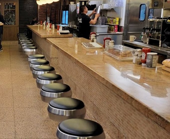 Counter seating: where solo diners become regulars and the short-order ballet unfolds before your eyes like delicious performance art.