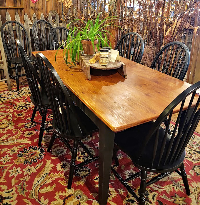 This farmhouse table isn't just furniture&mdash;it's the heart of a home waiting to happen. Those Windsor chairs have stories to tell and more to witness.