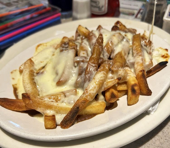 French toast that doesn't just host strawberries&mdash;it throws them a party complete with powdered sugar confetti and maple syrup cocktails.