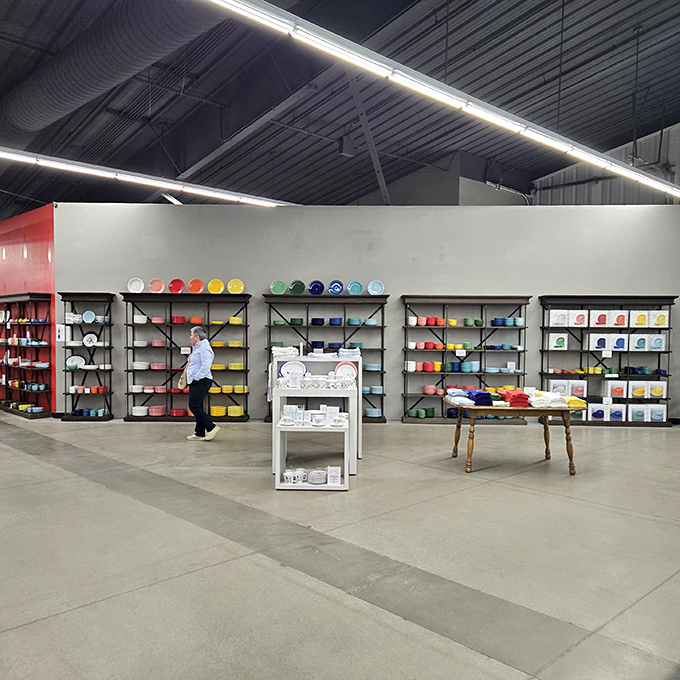 Colorful dishware displayed with retail precision proves that presentation matters, even when selling plates to eat off of.