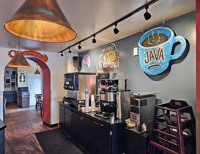 The coffee station stands ready for duty, with a blue neon mug sign that practically whispers, "You'll need me to balance all that pastrami."