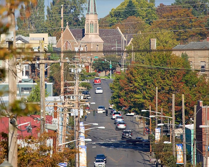 Tree-lined streets lead to church steeples and neighborhood shops in a scene straight from a "Best Places to Live" magazine spread.