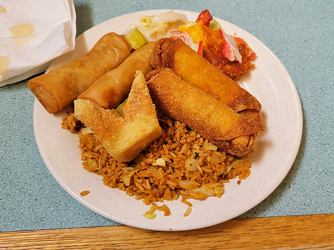 The starter pack of Chinese buffet happiness: crispy egg rolls, spring rolls, and fried rice that's anything but an afterthought.