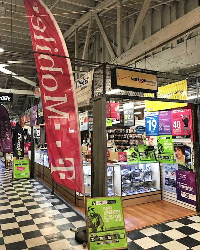 The modern meets the mercado at this tech booth, where yesterday's "latest models" become today's affordable communication solutions.