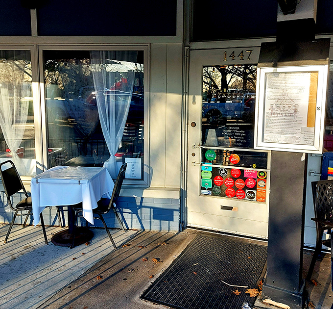 The exterior welcomes you with curtained patio seating that practically begs for warm summer evening dining experiences.