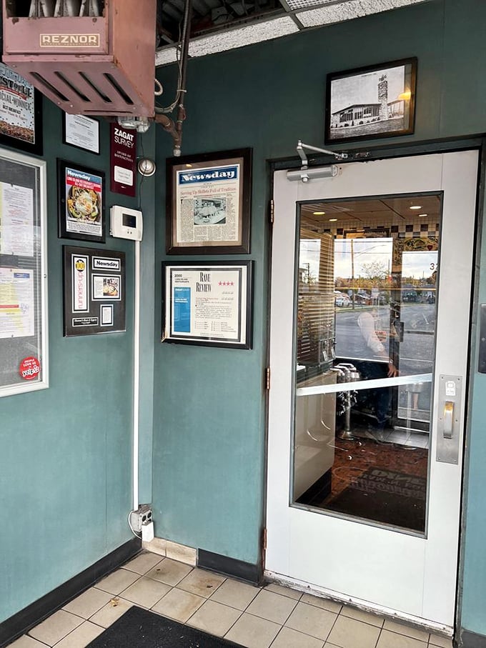 The entrance wall &ndash; a gallery of accolades and newspaper clippings that tell the story of a diner that's earned its place in local hearts.
