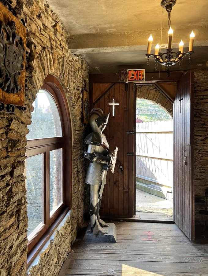A suit of armor guards the entrance, the medieval equivalent of those greeters at big box stores, but with significantly better posture.