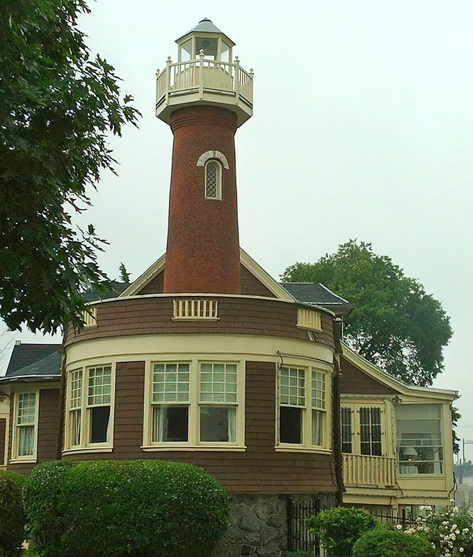The approach reveals how seamlessly the lighthouse integrates with its surroundings. A perfect example of architecture that enhances rather than intrudes.