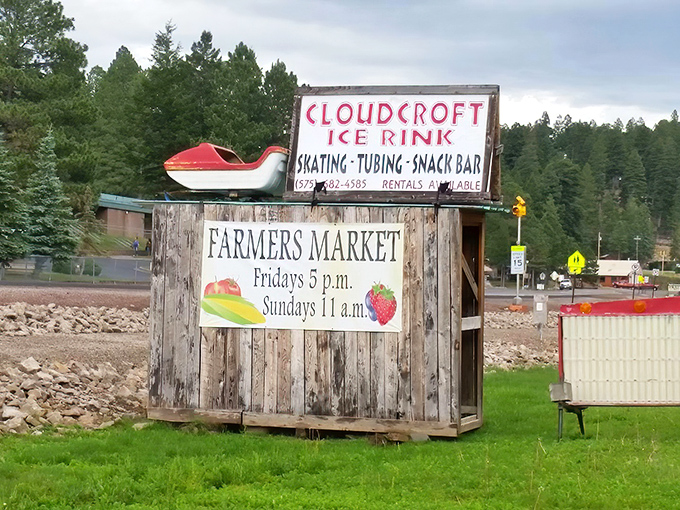 This rustic sign announces two essential mountain town institutions: ice skating and fresh produce. The farmers market schedule is practically an invitation.