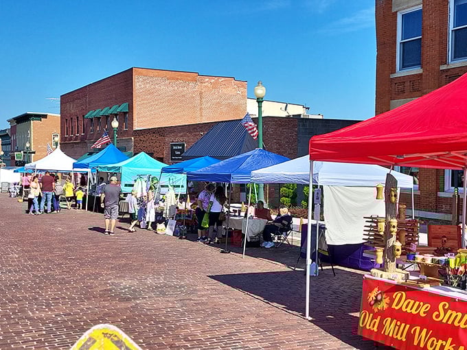 The farmers market stretches along brick streets, offering the kind of shopping experience Amazon can't algorithm its way into replicating.
