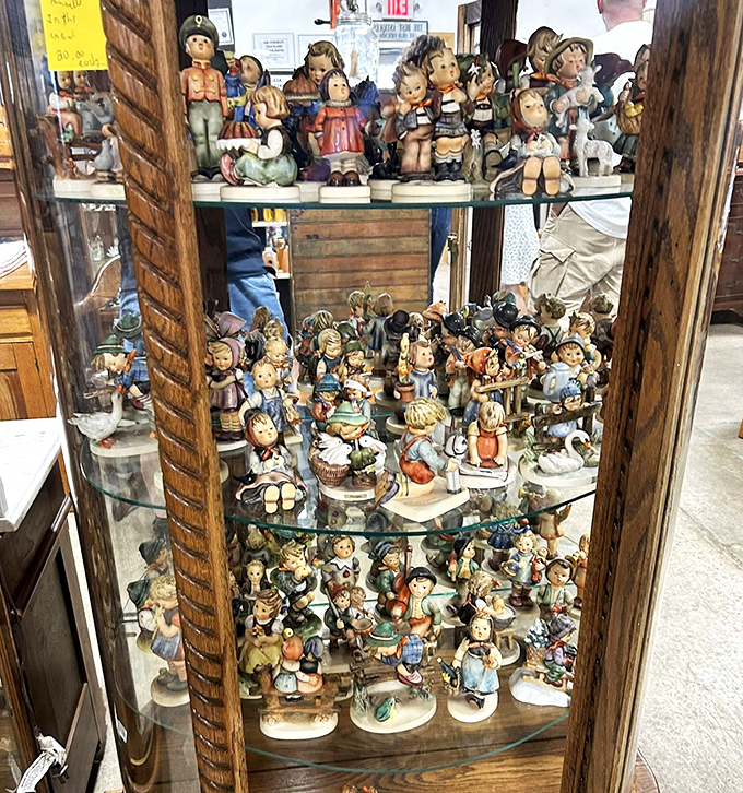 Hummel figurines having their own silent convention. These wide-eyed porcelain children have witnessed decades of dusting and family arguments.