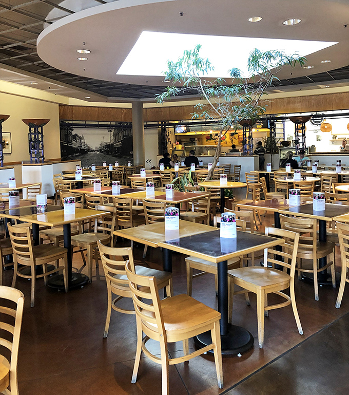 The food court: where shopping warriors refuel before the next retail battle. Those wooden chairs have supported countless shopping decisions.