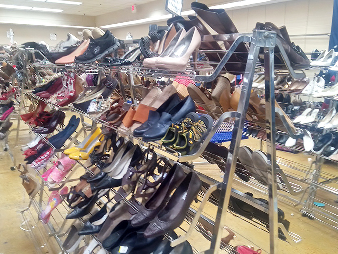 Shoe racks displaying footwear with plenty of life left&mdash;from barely-worn heels to gently-loved sneakers waiting for their next adventure.