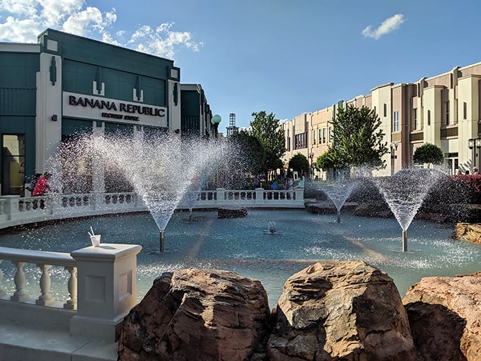 Fountains dance while Banana Republic watches, creating that upscale atmosphere where water features justify higher credit card bills somehow.