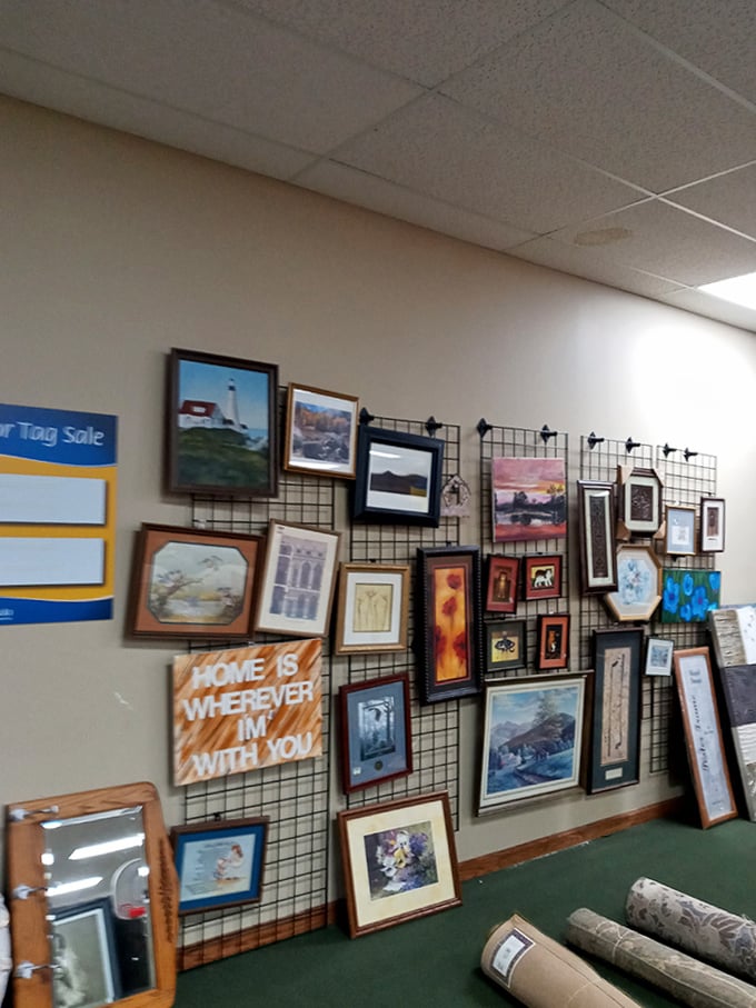 The wall of framed art offers instant sophistication for blank walls&mdash;because nobody needs to know it cost $12.