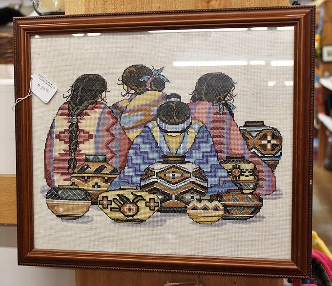 This meticulously cross-stitched artwork captures the essence of Native American pottery traditions with thousands of tiny, patient stitches.