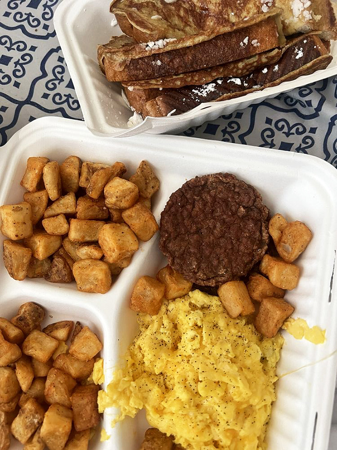 French toast and potatoes team up with eggs in a breakfast plate that understands you came here hungry and serious.