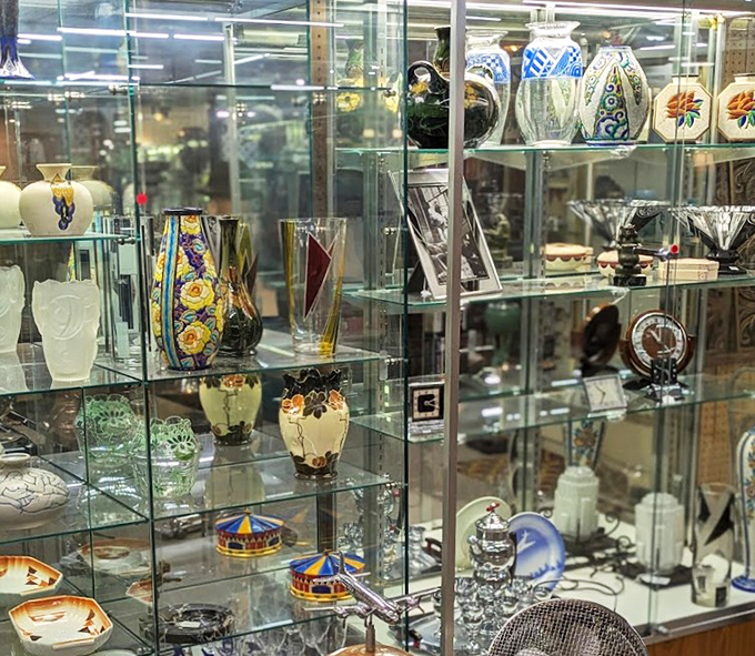 Delicate glassware and vases displayed like museum pieces. From Depression glass to mid-century modern designs, these fragile survivors have outlasted their original owners.