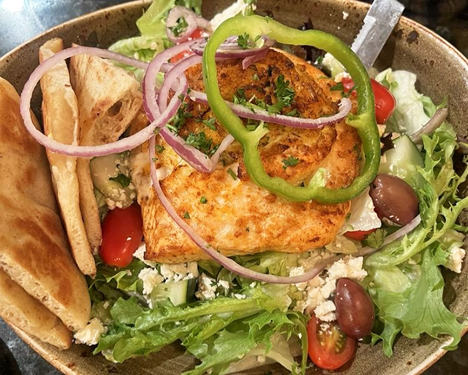This Greek salad topped with salmon proves healthy eating needn't be punishment. Those vibrant colors promise flavors that pop with each forkful.