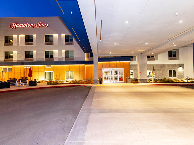 The Hampton Inn Selma glows invitingly at dusk, offering weary travelers a comfortable landing pad after a day of exploration.