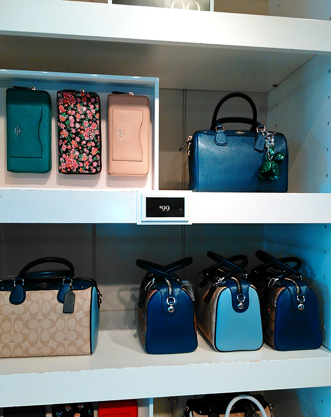 Designer handbag display that whispers "treat yourself" in the most convincing way. These Coach beauties are priced to make splurging feel surprisingly responsible.