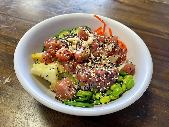 Hawaiian poke bowl bursting with colors that'd make a sunset jealous &ndash; and twice as satisfying.