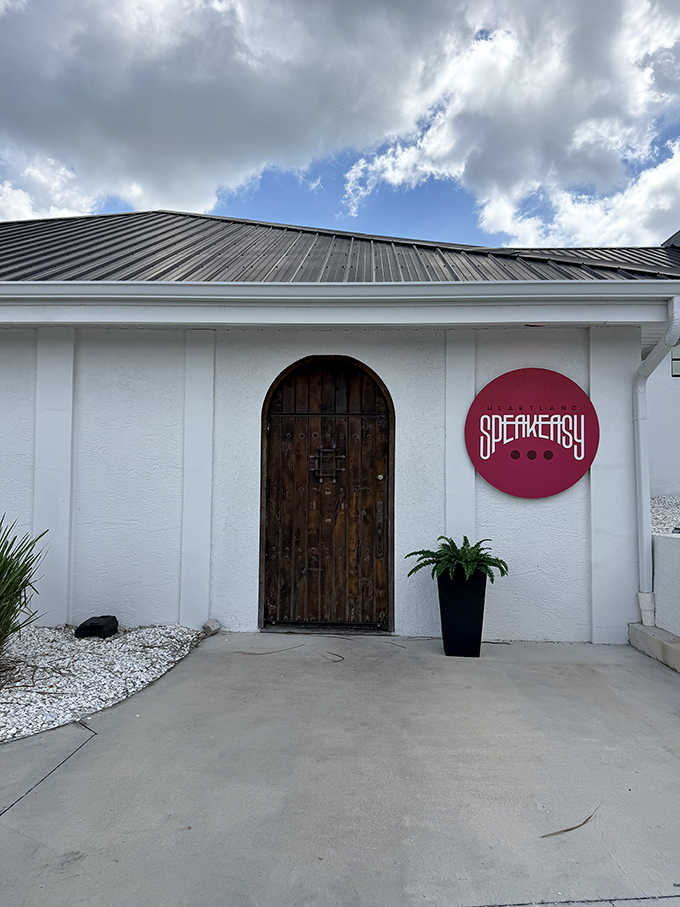 The Heartland Speakeasy's mysterious wooden door and minimalist signage hint at Prohibition-era fun. Password not required, but a sense of adventure is recommended.