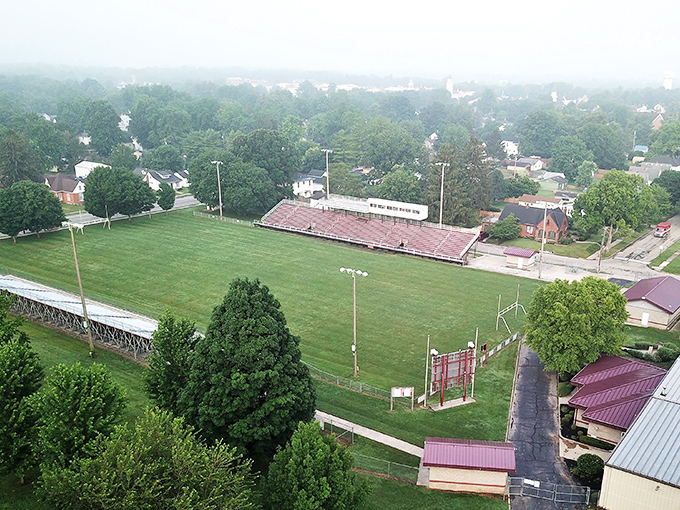 From this aerial view, Hillclimber Stadium waits patiently for Friday nights when it transforms from empty bleachers to the beating heart of community pride.