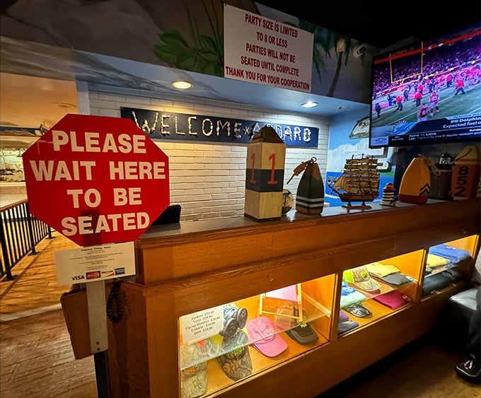 Another view of the welcoming entrance area, where the "Please Wait to be Seated" sign might as well say "Patience Will Be Rewarded with Hush Puppies."