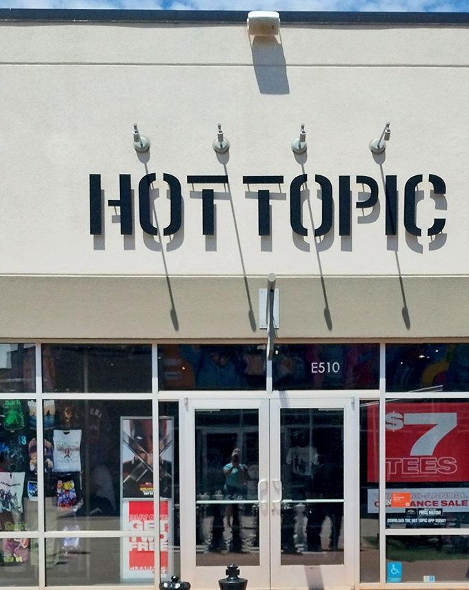 Hot Topic remains the teenage rebellion headquarters, where parents wait outside while their kids transform into mall goths inside.
