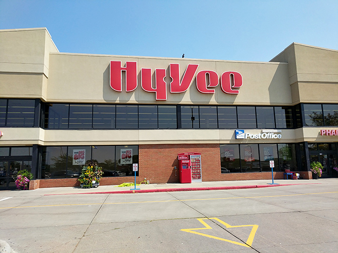The familiar Hy-Vee sign represents more than just groceries&mdash;it's a community hub where neighbors exchange recipes and local gossip with equal enthusiasm.