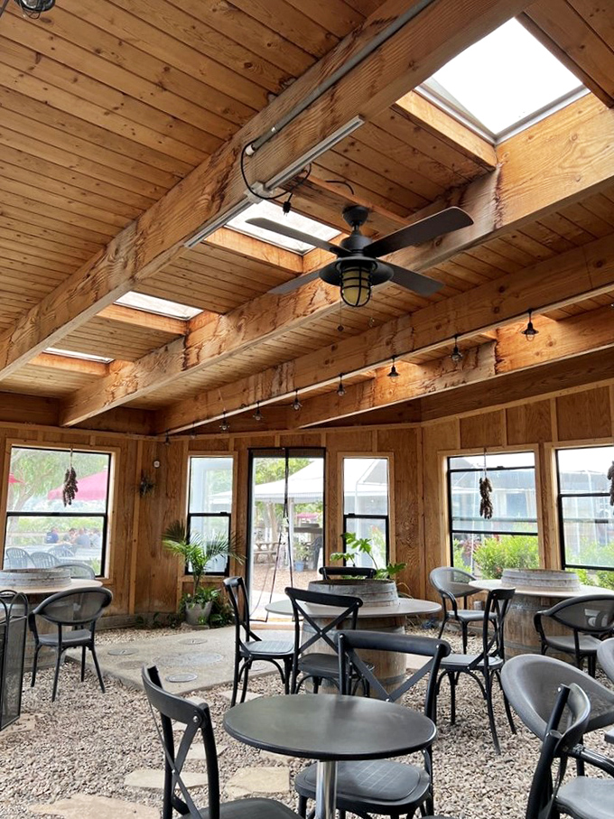 Natural light floods this indoor patio through skylights, creating the perfect ambiance for a long lunch that stretches lazily into the afternoon.