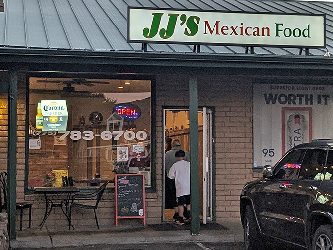JJ's Mexican Food might look unassuming, but those neon "Open" signs often signal the best authentic flavors hiding in plain sight.