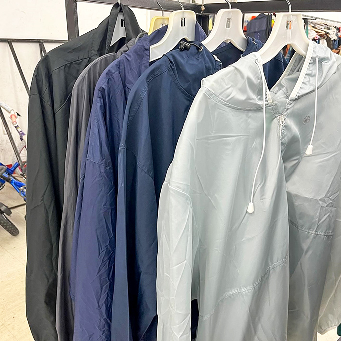 A lineup of lightweight jackets in businessman blues, like a corporate uniform liberation sale where casual Friday meets everyday practicality.