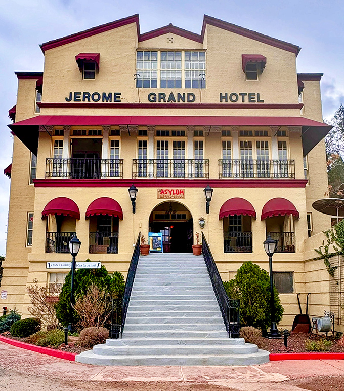 The Jerome Grand Hotel's grand staircase welcomes visitors like they're checking into Arizona's most historically significant mountaintop accommodation.